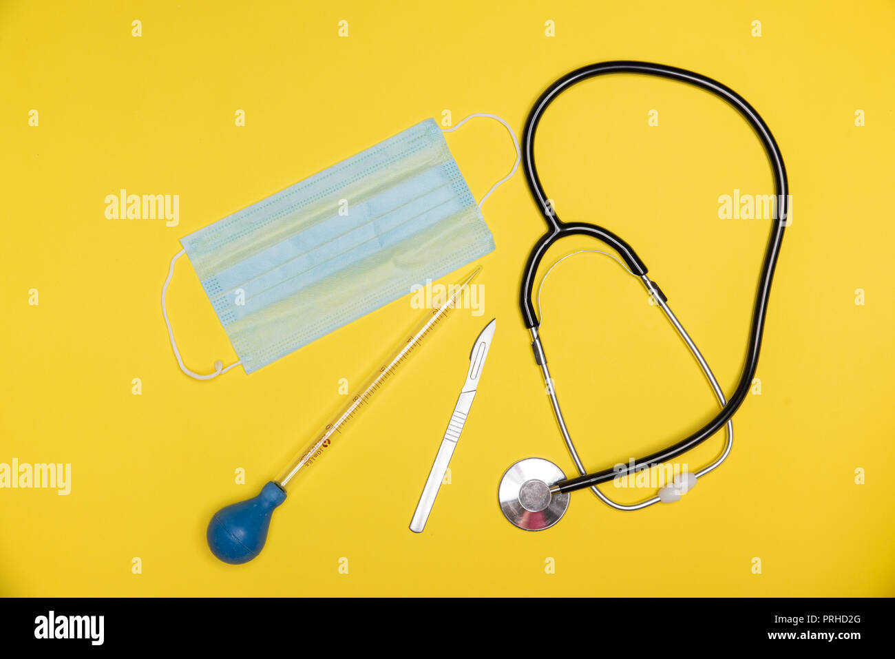 Precission sharp knife with sterile mouth face mask, stethoscope and ...