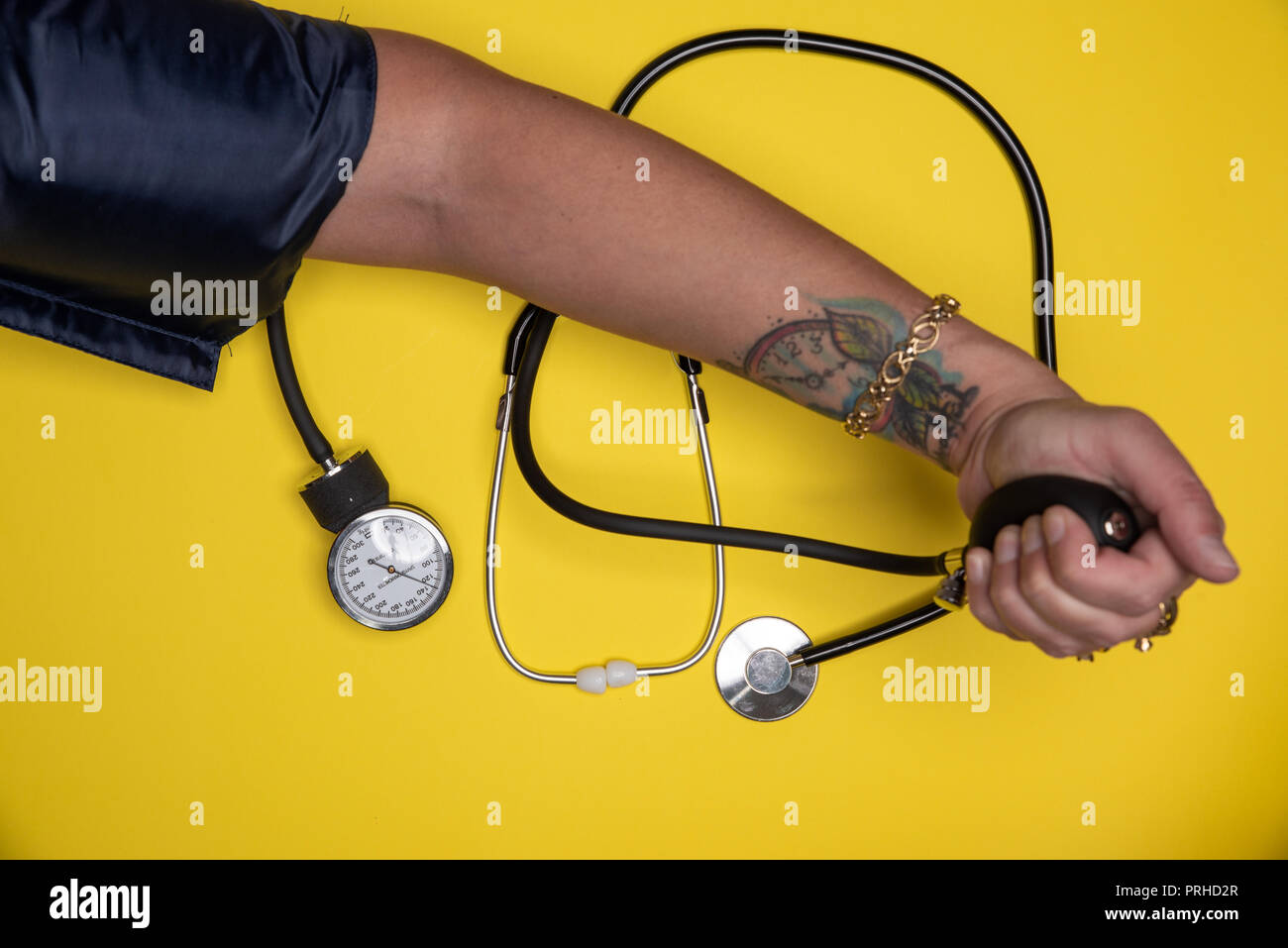 Hand checking blood pressure and stethoscope set aside. Diagnosis ...