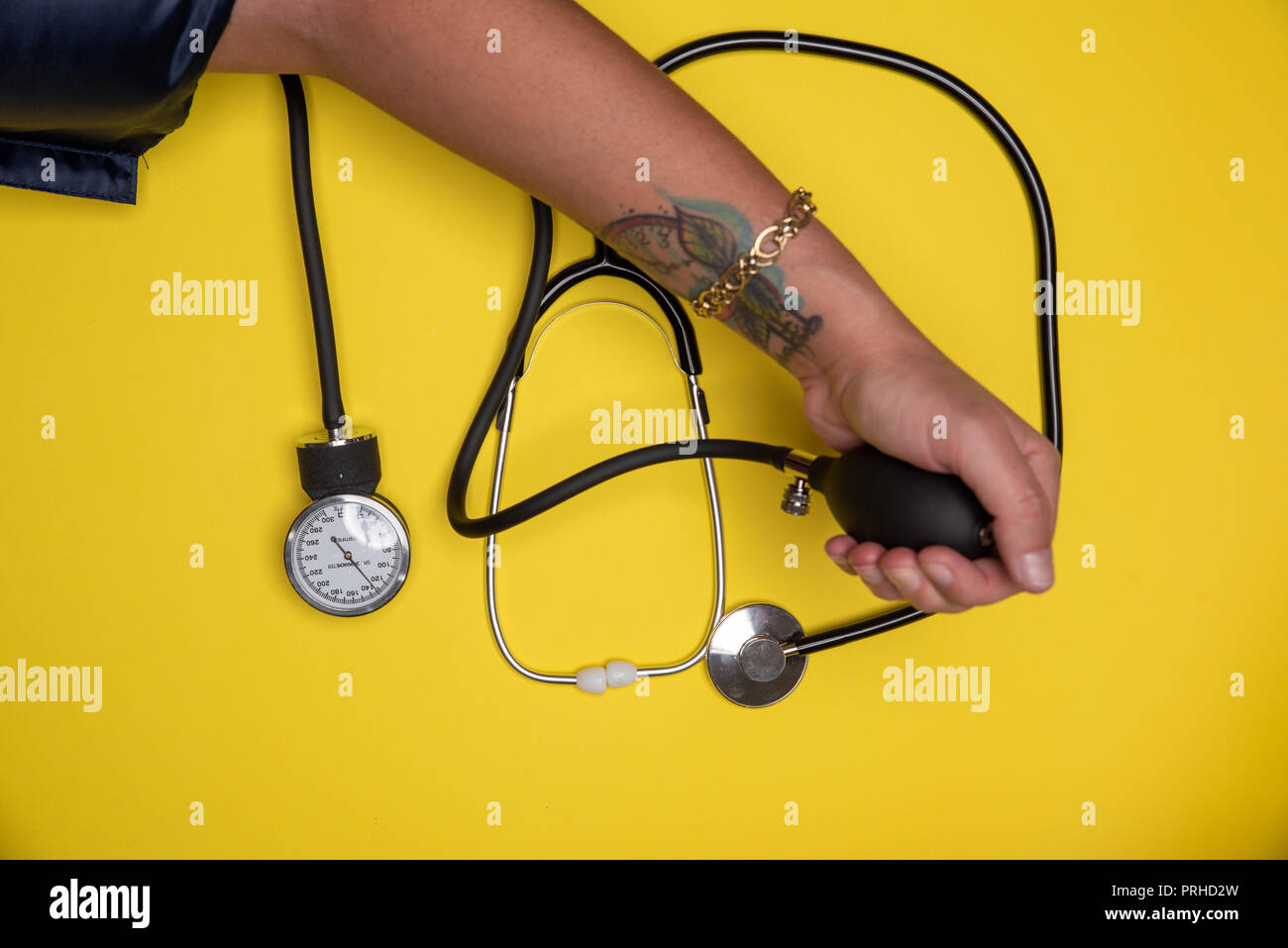 Hand checking blood pressure and stethoscope set aside. Diagnosis ...