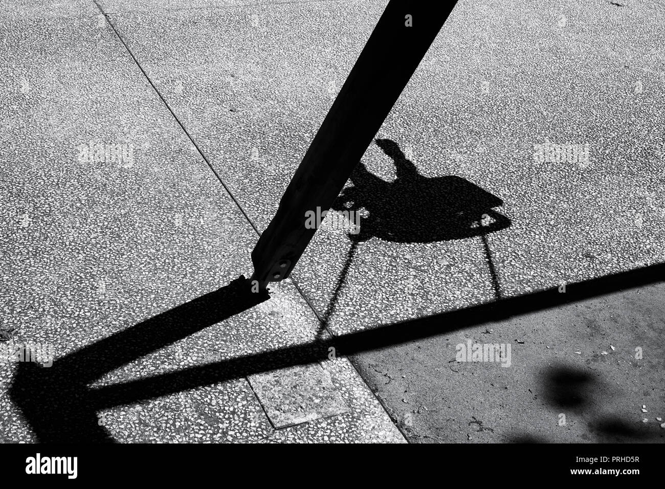 A shadow of a child on a swing Stock Photo - Alamy