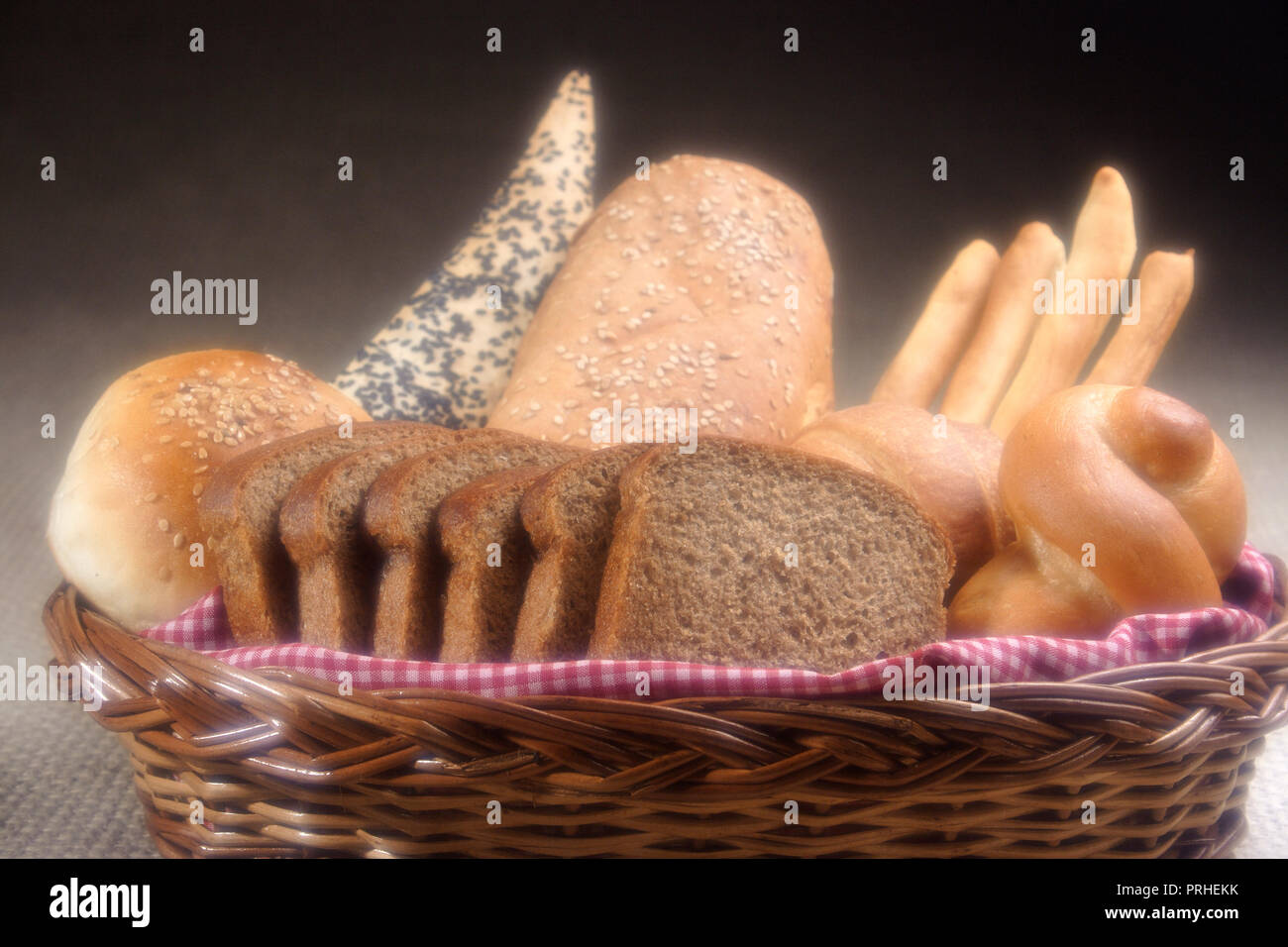 Assorted bread in a basket, soft focus Stock Photo - Alamy