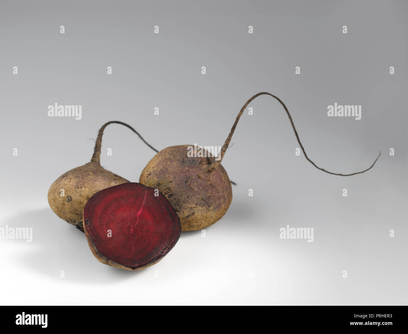 Beetroot whole and cut on a white background Stock Photo - Alamy