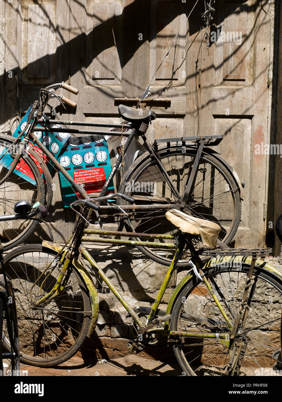 A STILL LIFE OF Bicycles ON A STREET IN FRONT OF AN OLD HOUSE, Mumbai ...