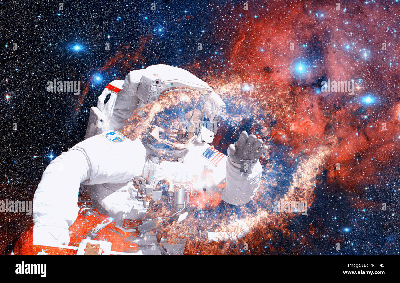 Astronaut in deep space against the background of the nebula. Elements ...