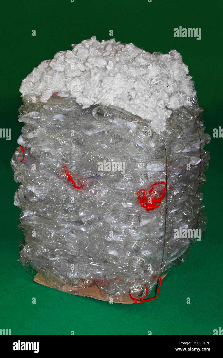Crushed clear plastic bottles compacted in bale Stock Photo - Alamy