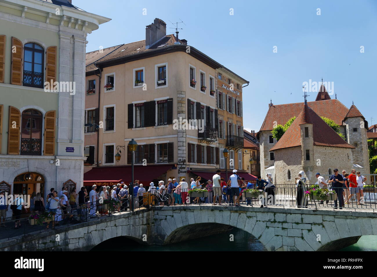 Tourists on a bridge with shops and cafes Annecy France Stock Photo - Alamy