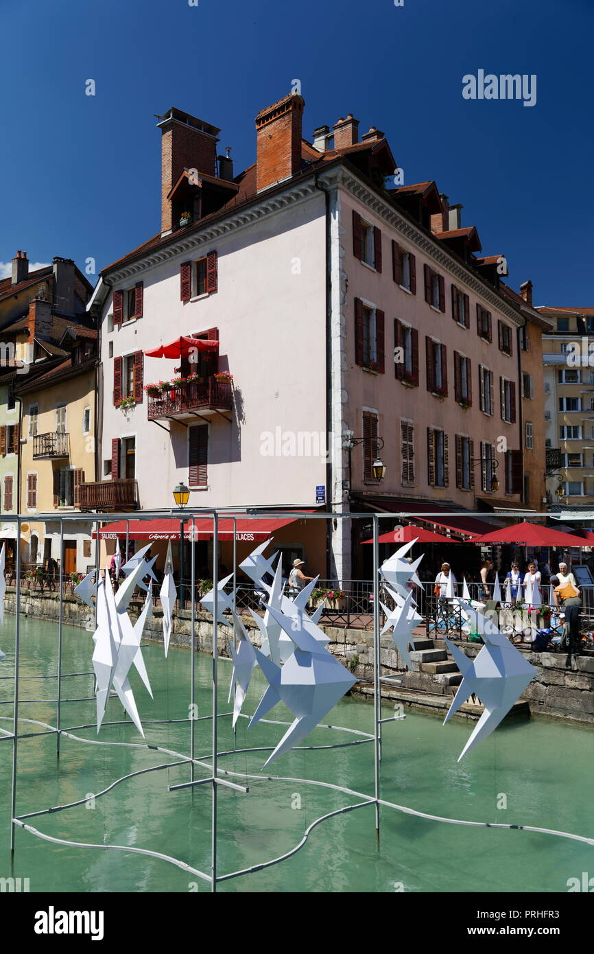 Art exhibition white fish in a frame on the river thiou Annecy France ...