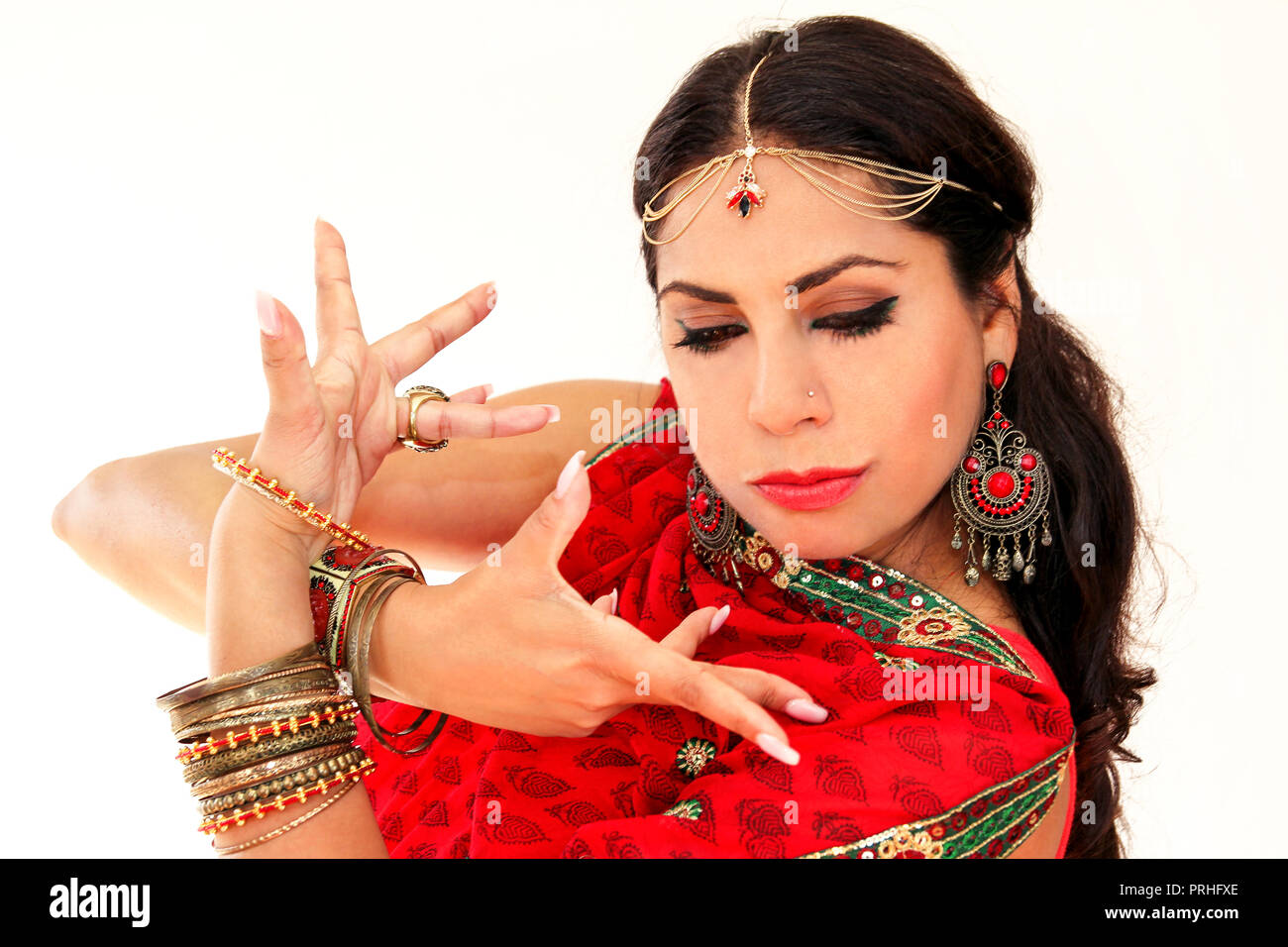Woman dancing Indian dance in national dress. A handsome beautiful girl ...