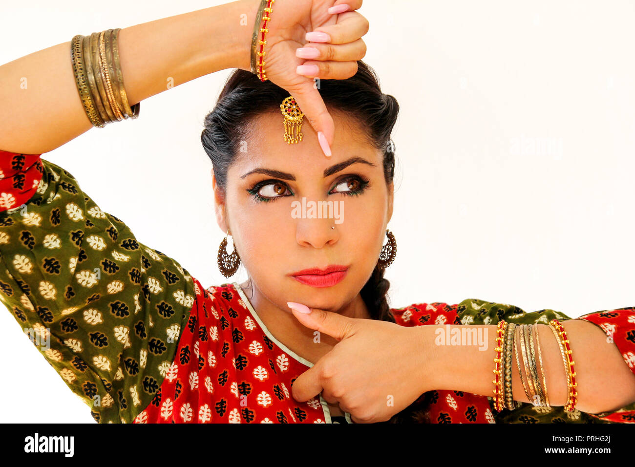 Woman dancing Indian dance in national dress. A beautiful girl portrait ...