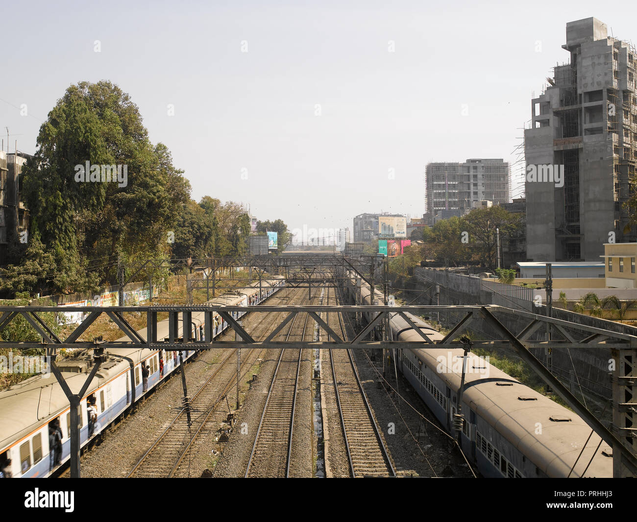 VIEW OF RAILWAY TRACKS AND LOCAL TRAINS IN MUMBAI, INDIA, ASIA Stock ...