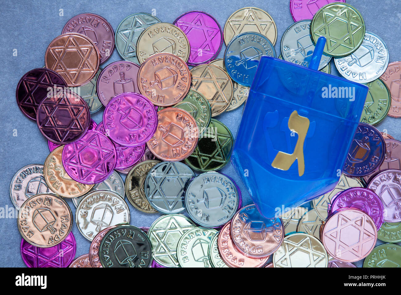 Large translucent blue plastic dreidl showing the Hebrew letter Gimel ...