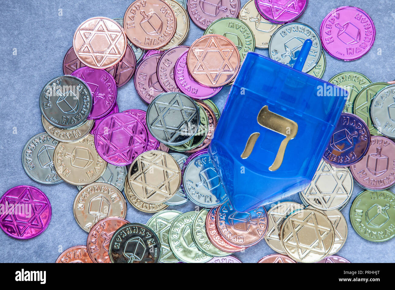 Large translucent blue plastic dreidl showing the Hebrew letter Hey ...