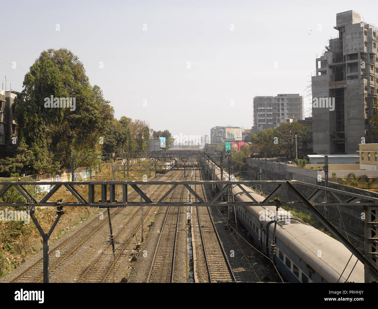 VIEW OF RAILWAY TRACKS AND LOCAL TRAINS IN MUMBAI, INDIA, ASIA Stock ...