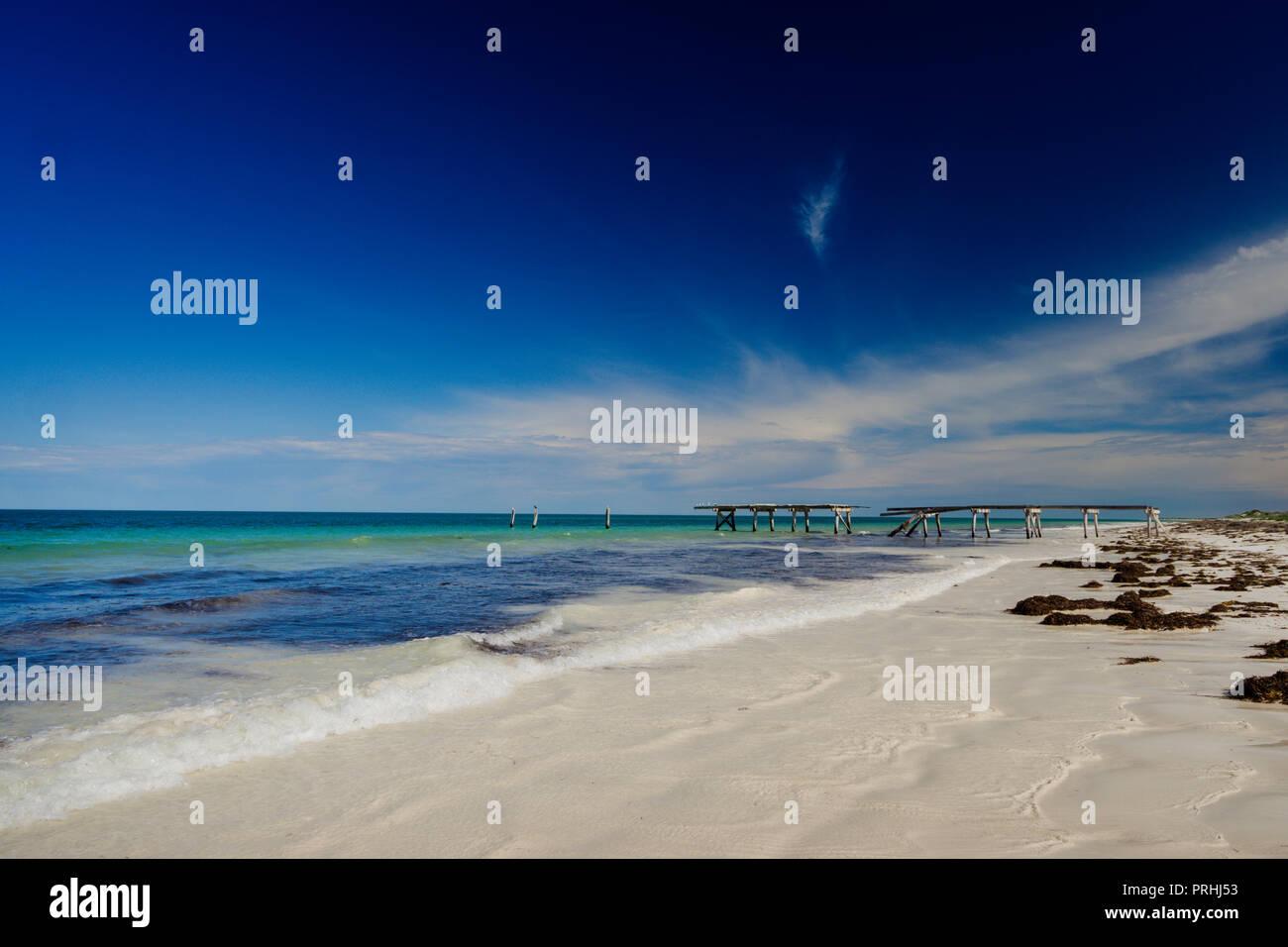 The ruins of the old historic wooden jetty on the coastline at Eucla ...