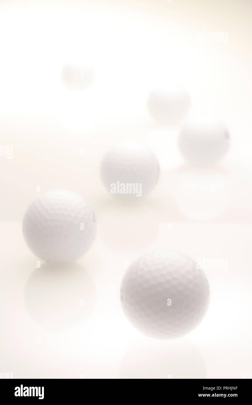 Golf balls on a white background Stock Photo - Alamy