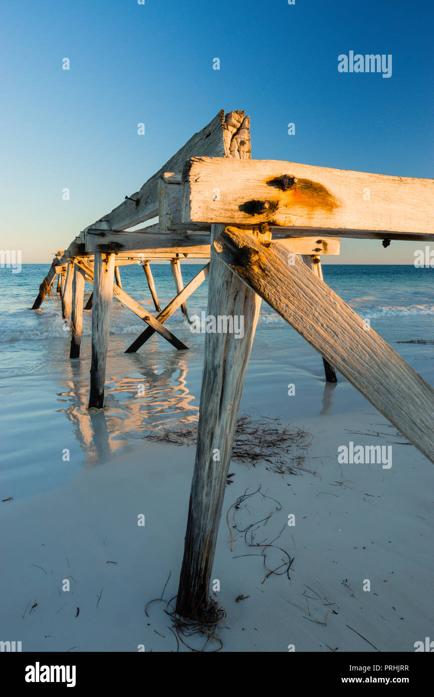 The ruins of the old historic wooden jetty on the coastline at Eucla ...