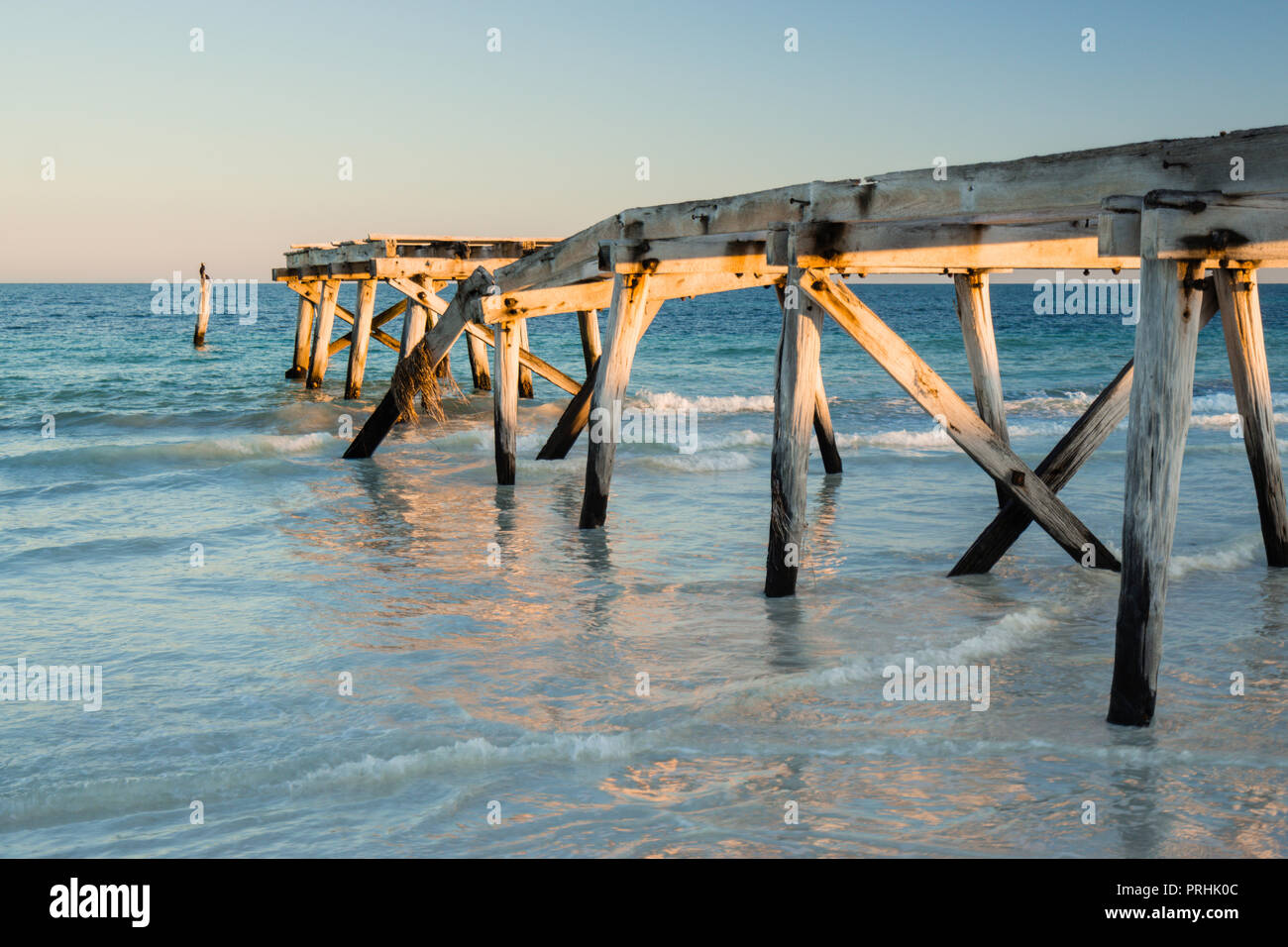 The ruins of the old historic wooden jetty on the coastline at Eucla ...