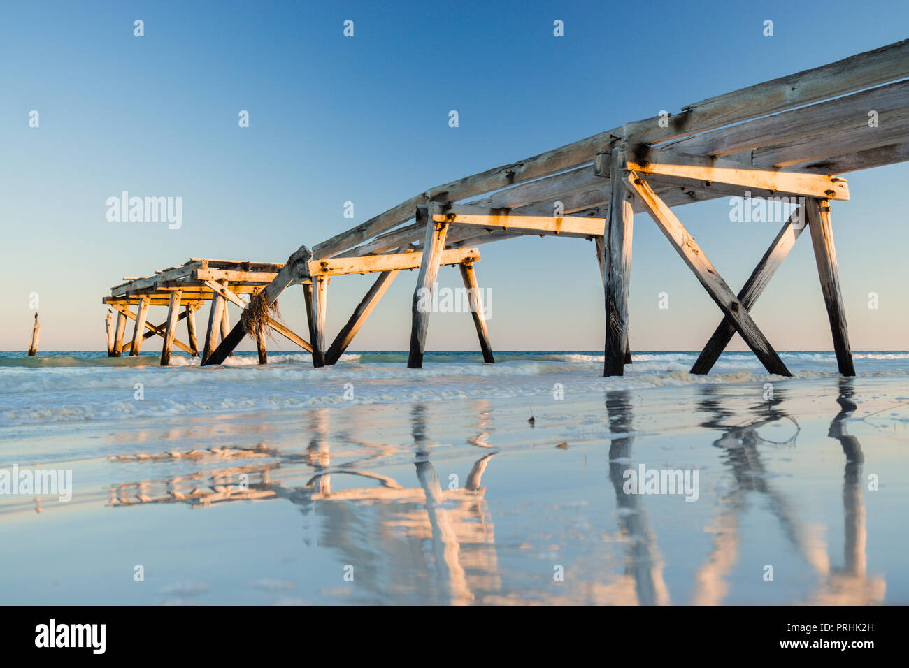 The ruins of the old historic wooden jetty on the coastline at Eucla ...