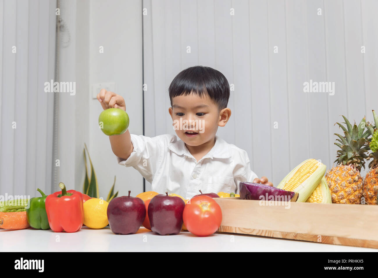 Healthy and nutrition concept. Kid learning about nutrition to choose ...