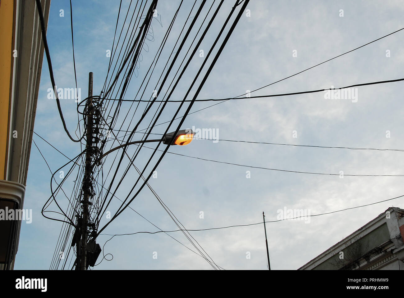 Street light with a lot of wires Stock Photo - Alamy
