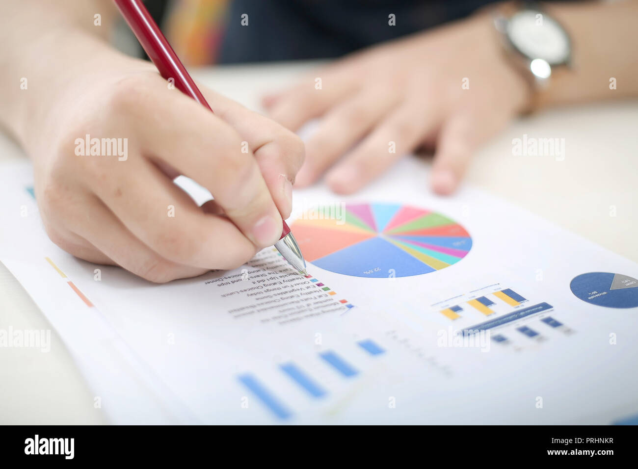 Man is studying the pie chart and bar graph Stock Photo - Alamy