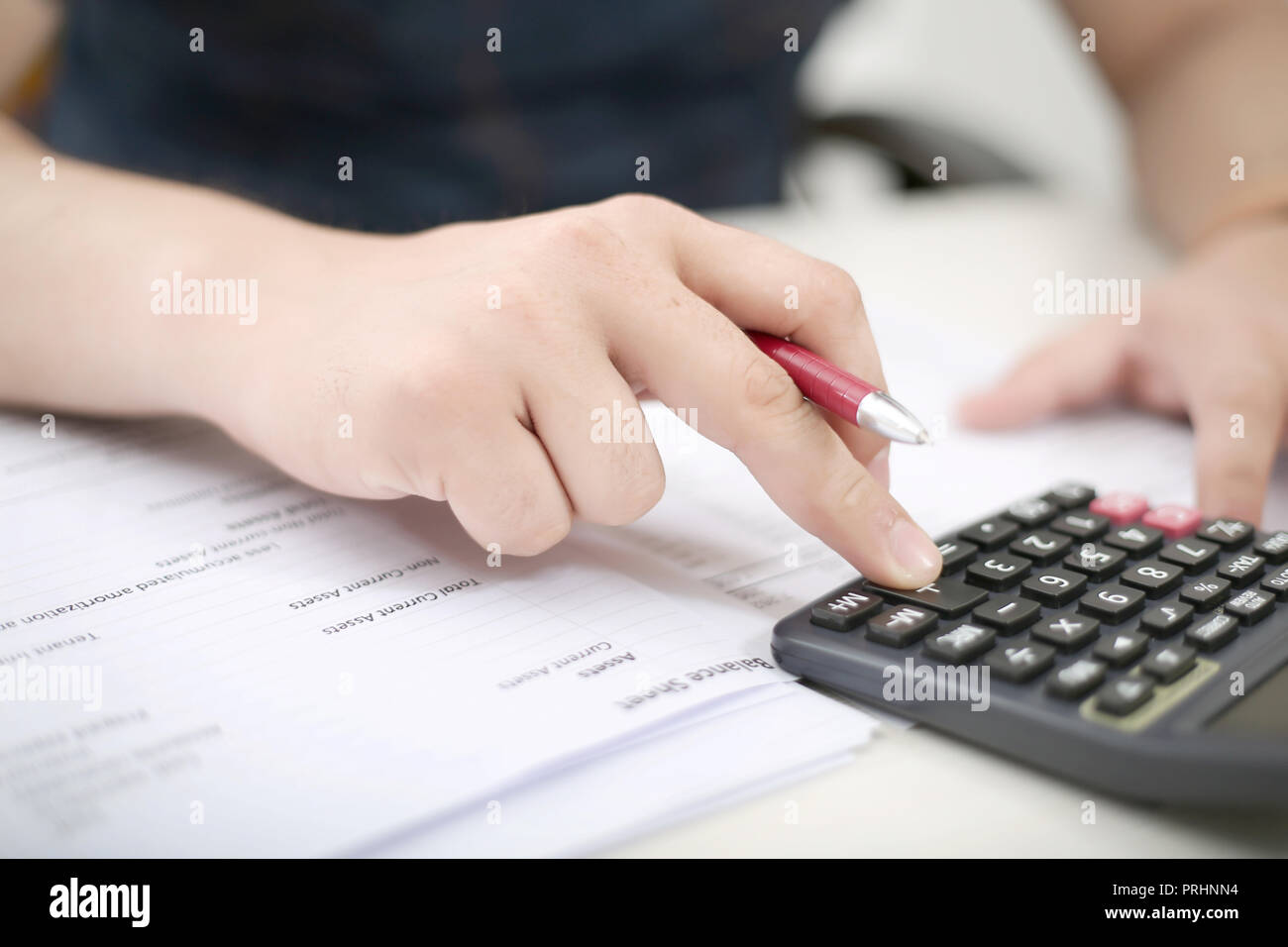 Man men male using calculator hi-res stock photography and images - Alamy