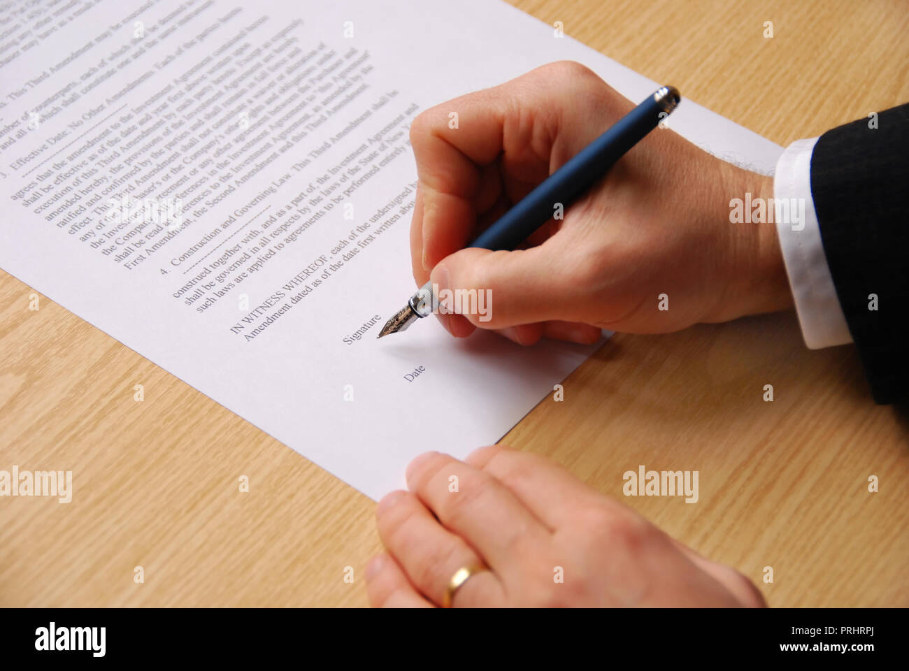 Hand signing hi-res stock photography and images - Alamy