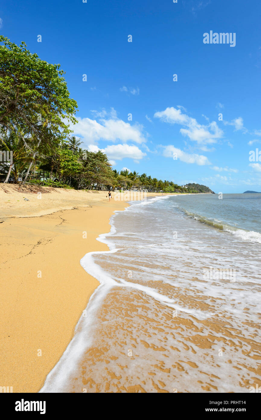 Person walking along the beach at Trinity Beach, Cairns Northern ...