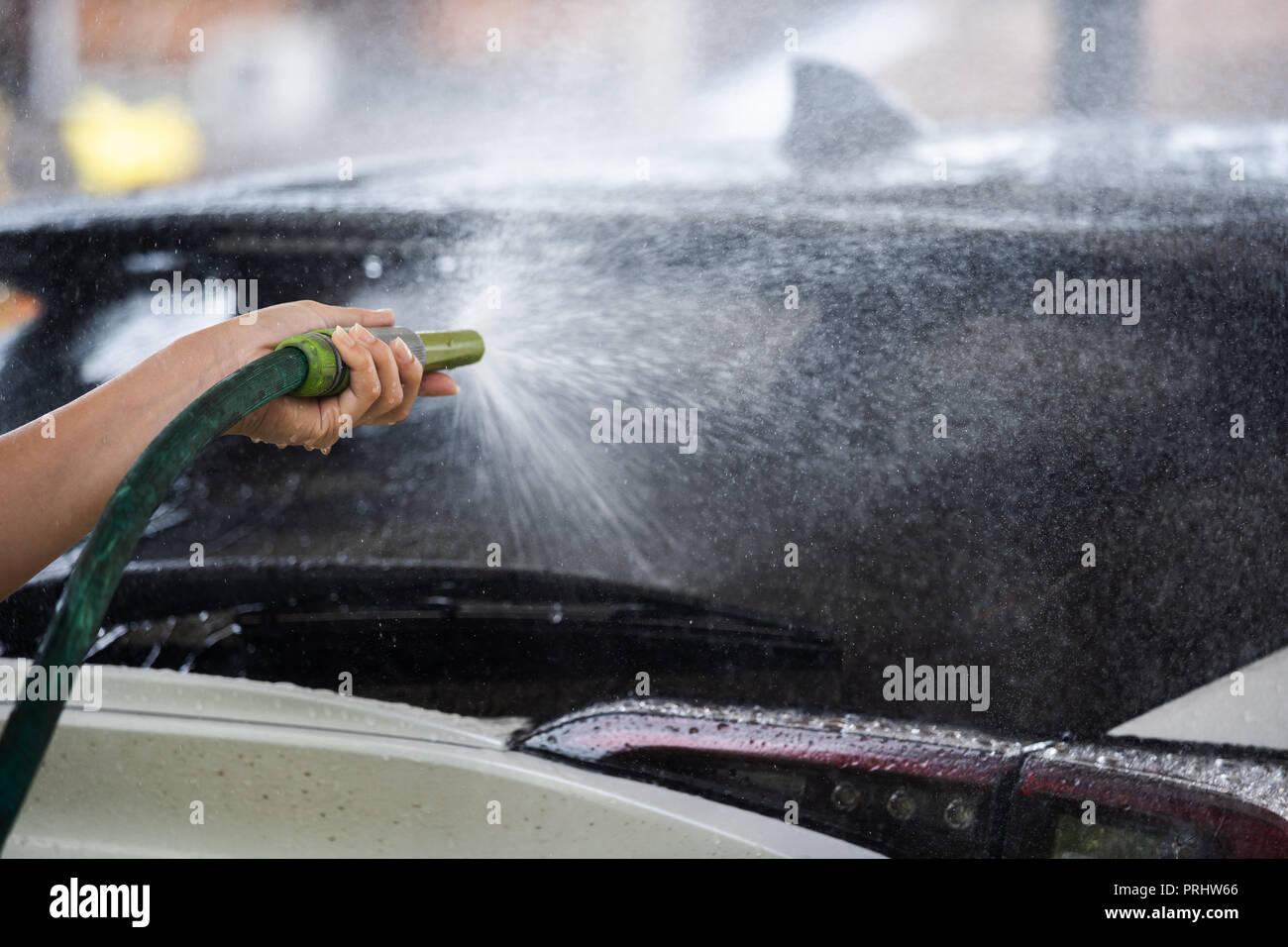 car washing with a spray water Stock Photo - Alamy