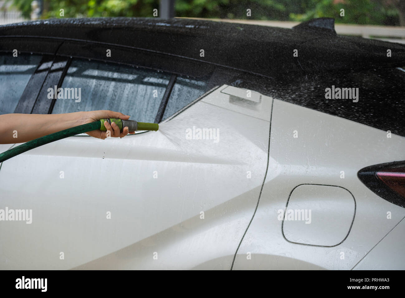 car washing with a spray water Stock Photo - Alamy