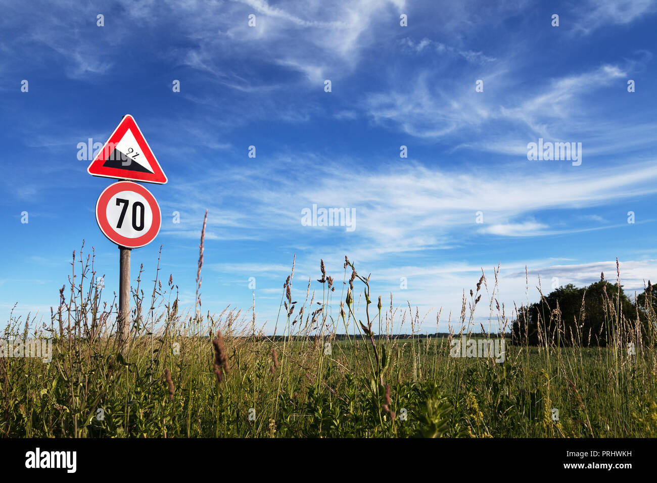 Road sign in a field Stock Photo - Alamy