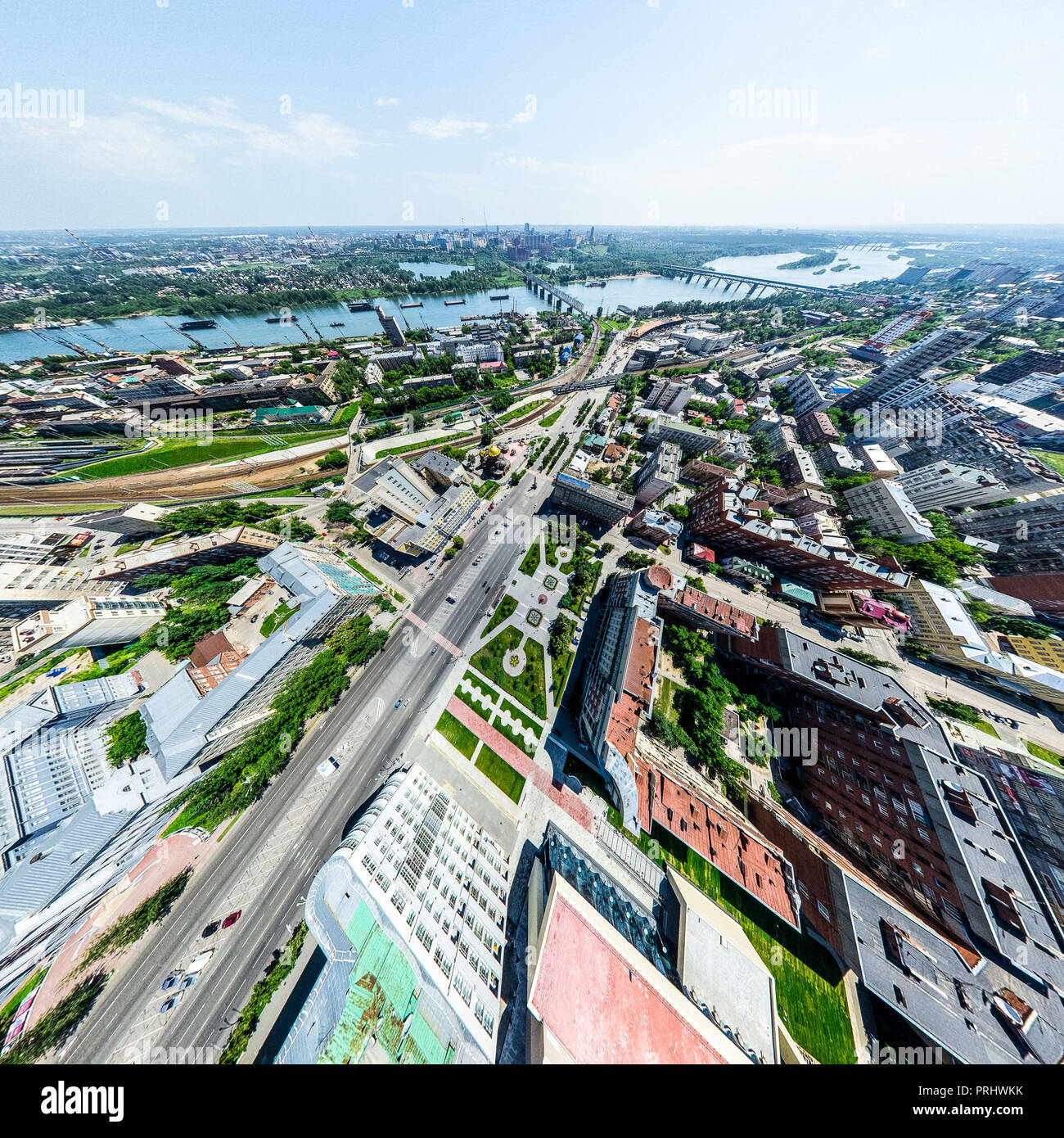 Aerial city view with crossroads and roads, houses, buildings, parks ...