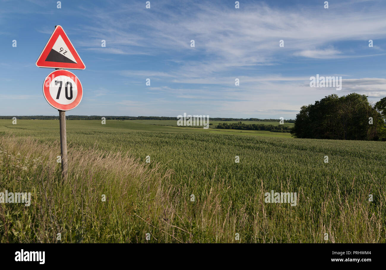 Road sign in a field Stock Photo - Alamy