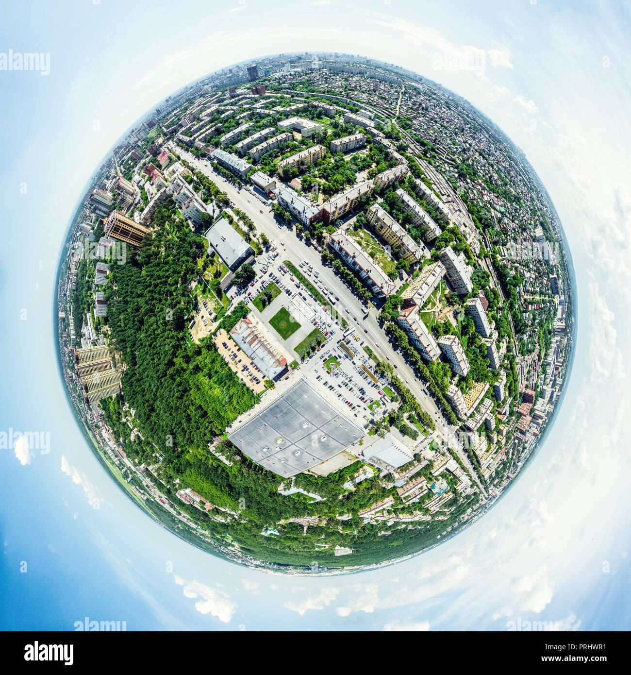 Aerial city view with crossroads and roads, houses, buildings, parks ...