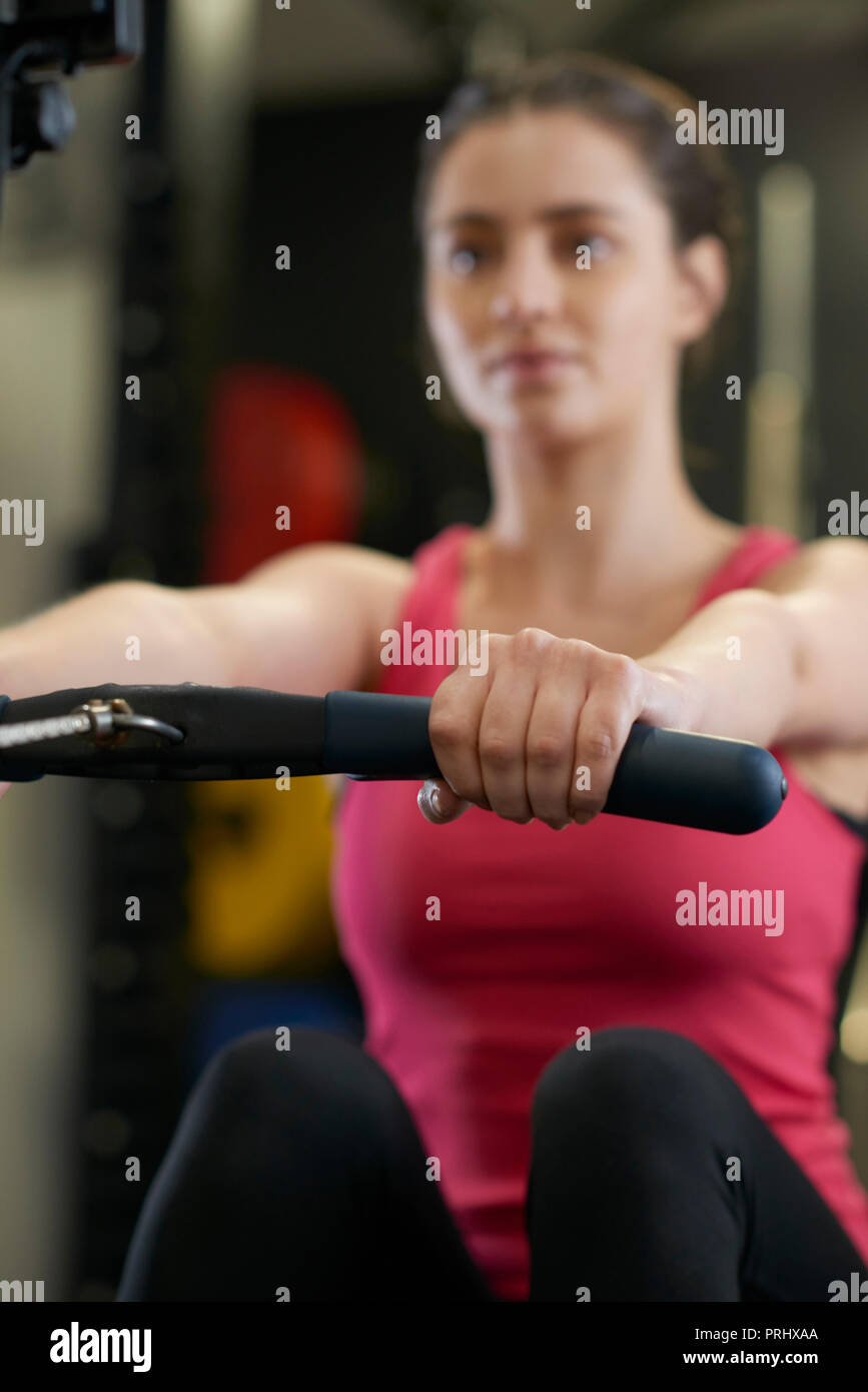 Female on rowing machine hi-res stock photography and images - Alamy