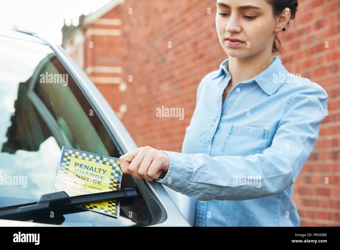 Frustrated Male Motorist Looking At Parking Ticket Stock Photo - Alamy
