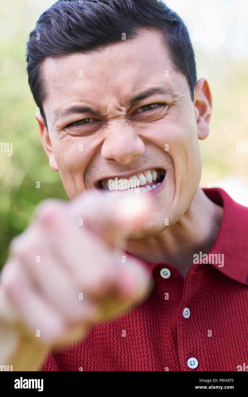 Outdoor Shot Of Angry Young Man Shouting And Pointing At Camera Stock ...