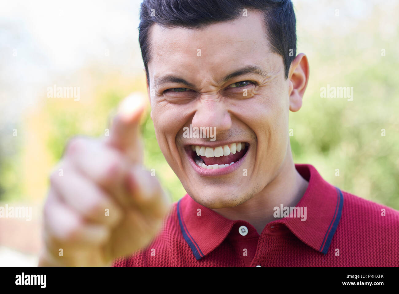 Outdoor Shot Of Angry Young Man Shouting And Pointing At Camera Stock ...