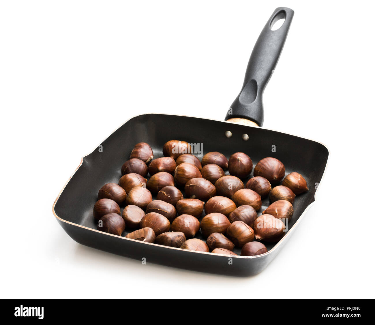 Chestnuts in grill pan Cut Out Stock Images & Pictures - Alamy