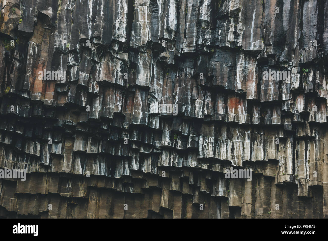 full frame image of black basalt column formation of Svartifoss in ...