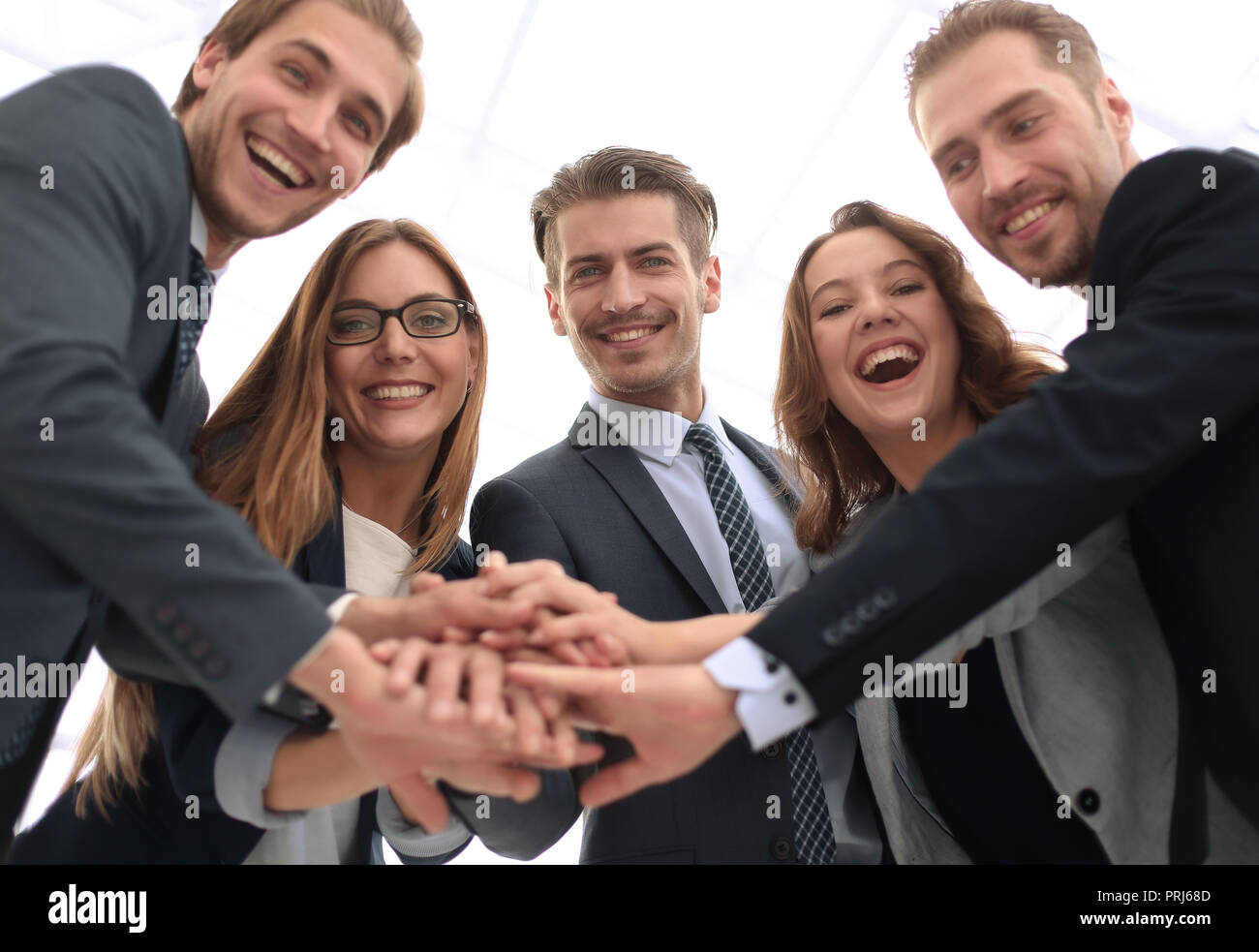 happy business team celebrating victory in office Stock Photo - Alamy