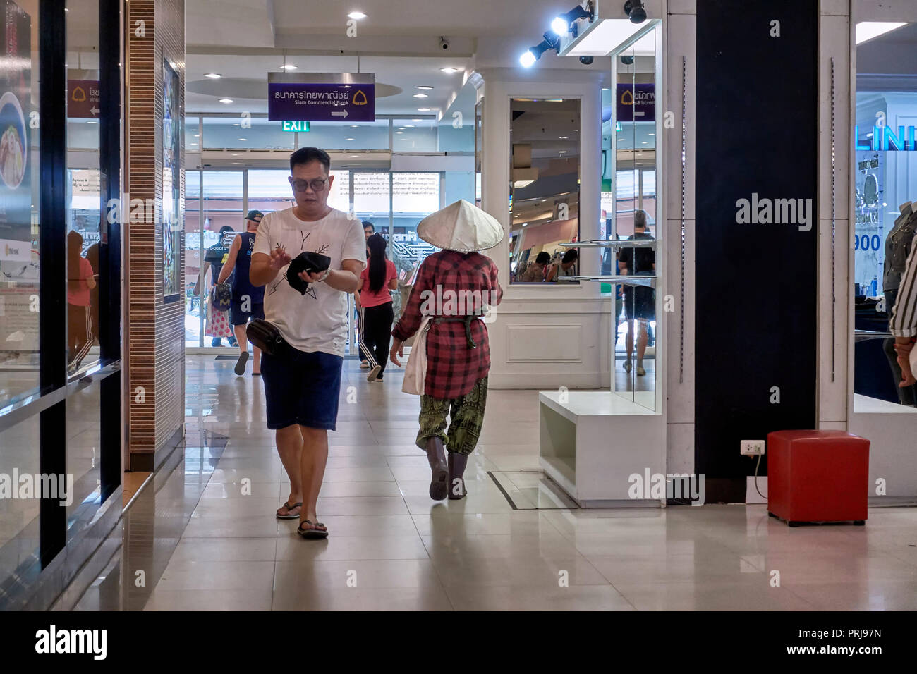 Thailand shopping mall interior with both city and rural shoppers ...