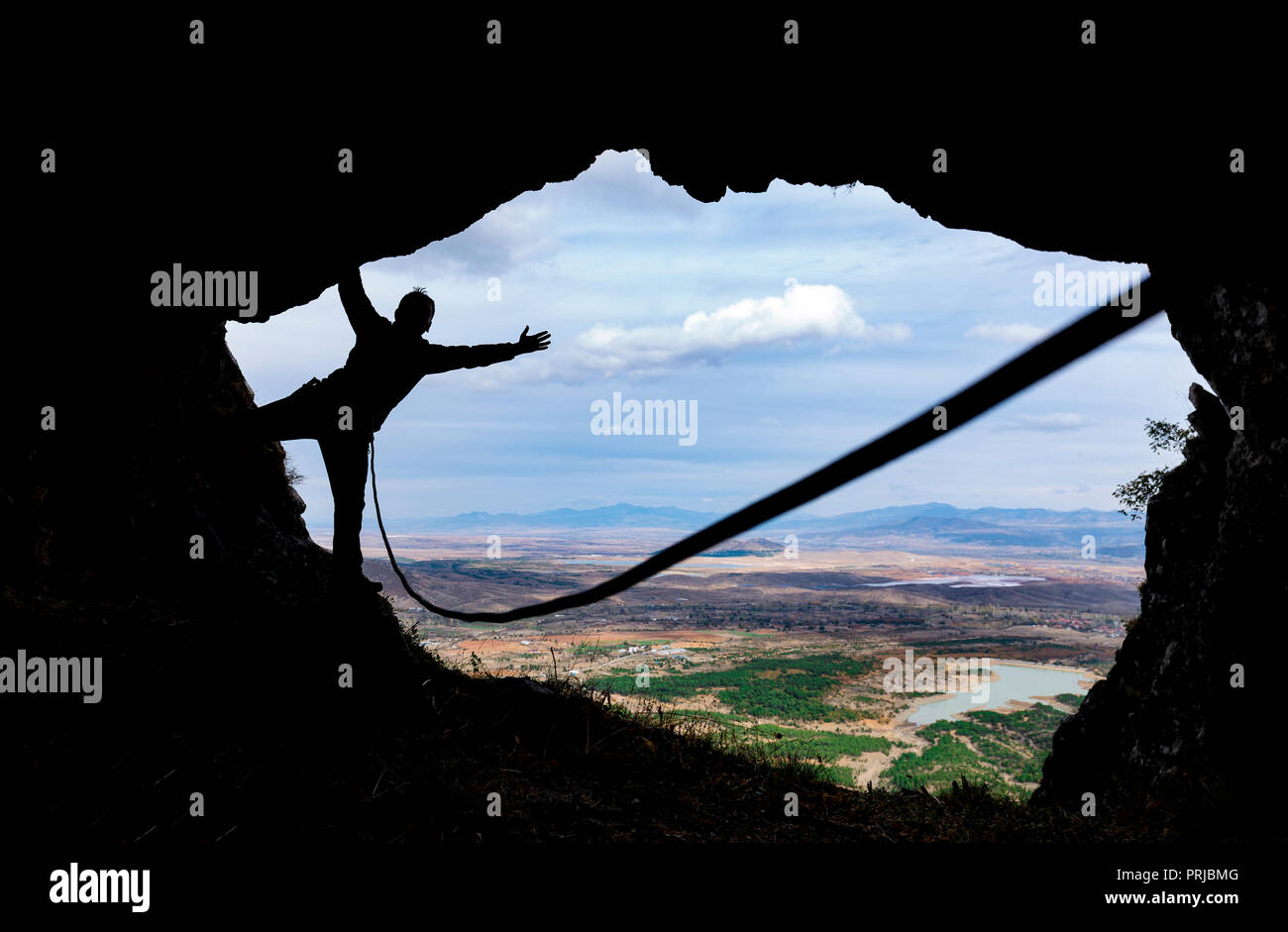 climbing with rope in the cave Stock Photo - Alamy