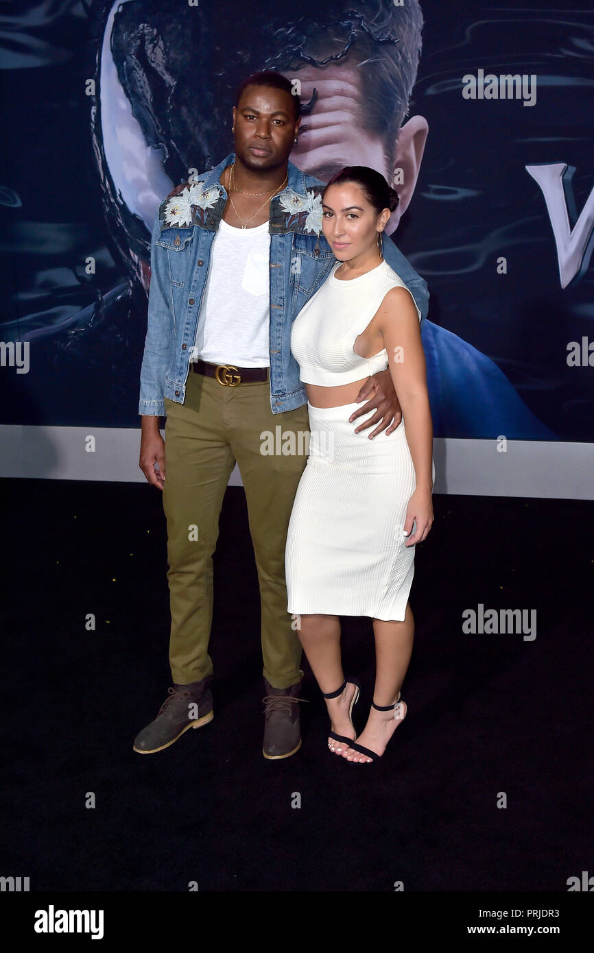 Kelz Washington and guest attending the 'Venom' premiere at Regency ...