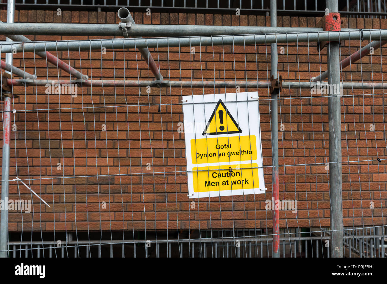 Caution man at work sign, Wales, UK Stock Photo - Alamy