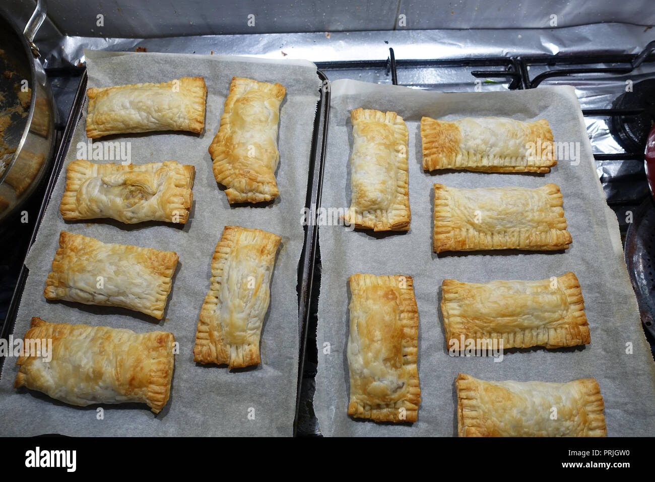 Freshly baked puff pastry on a baking tray Stock Photo - Alamy