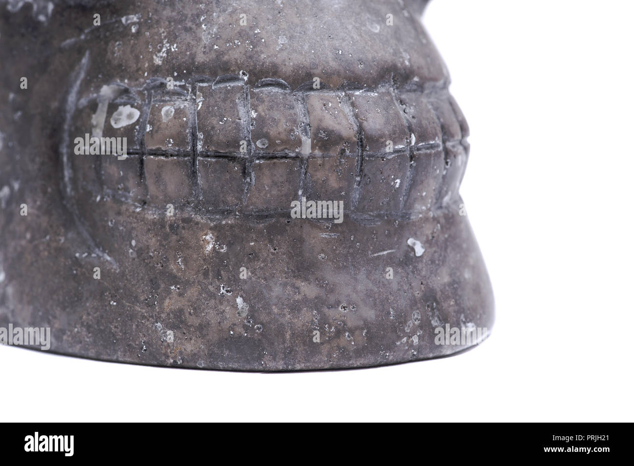 Grey volcanic rock carved skull isolated on white background Stock ...