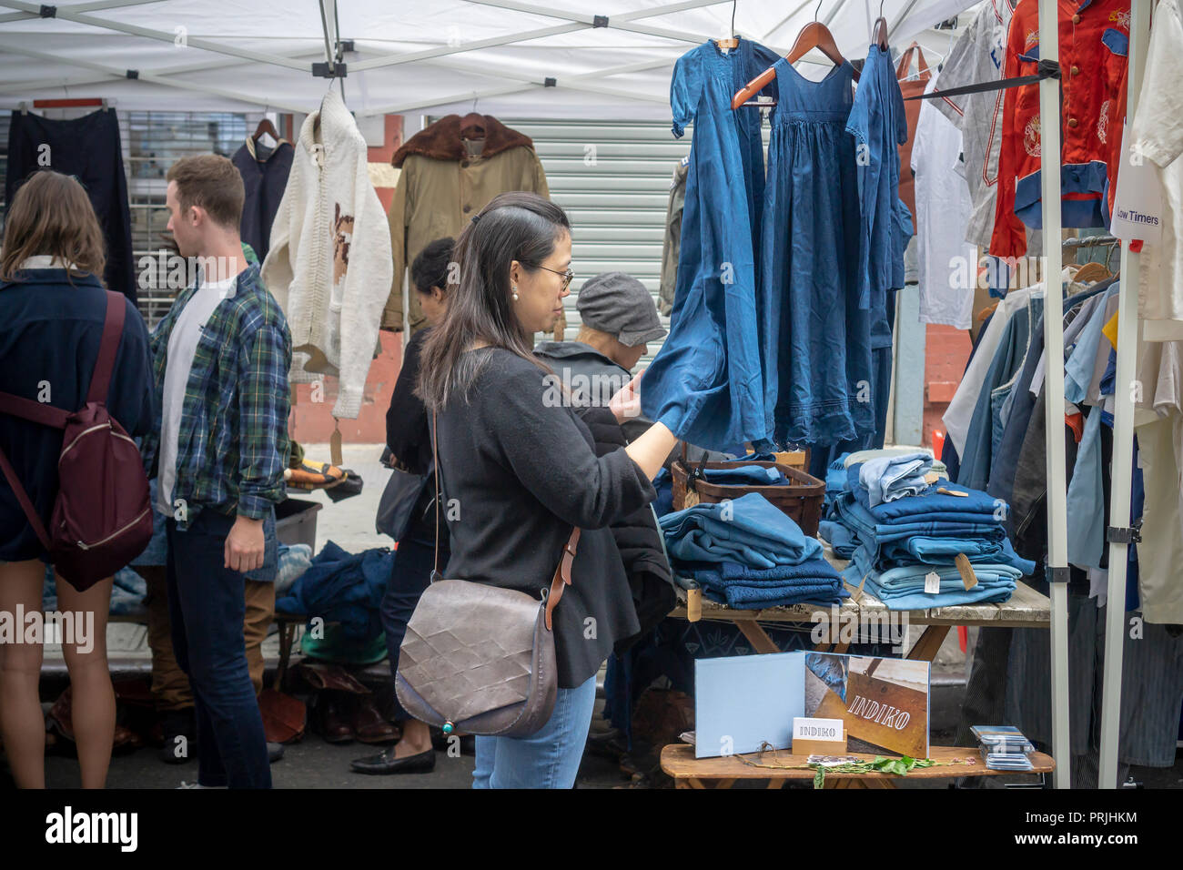 Aficionados of denim browse clothing and accessories at a specialty ...