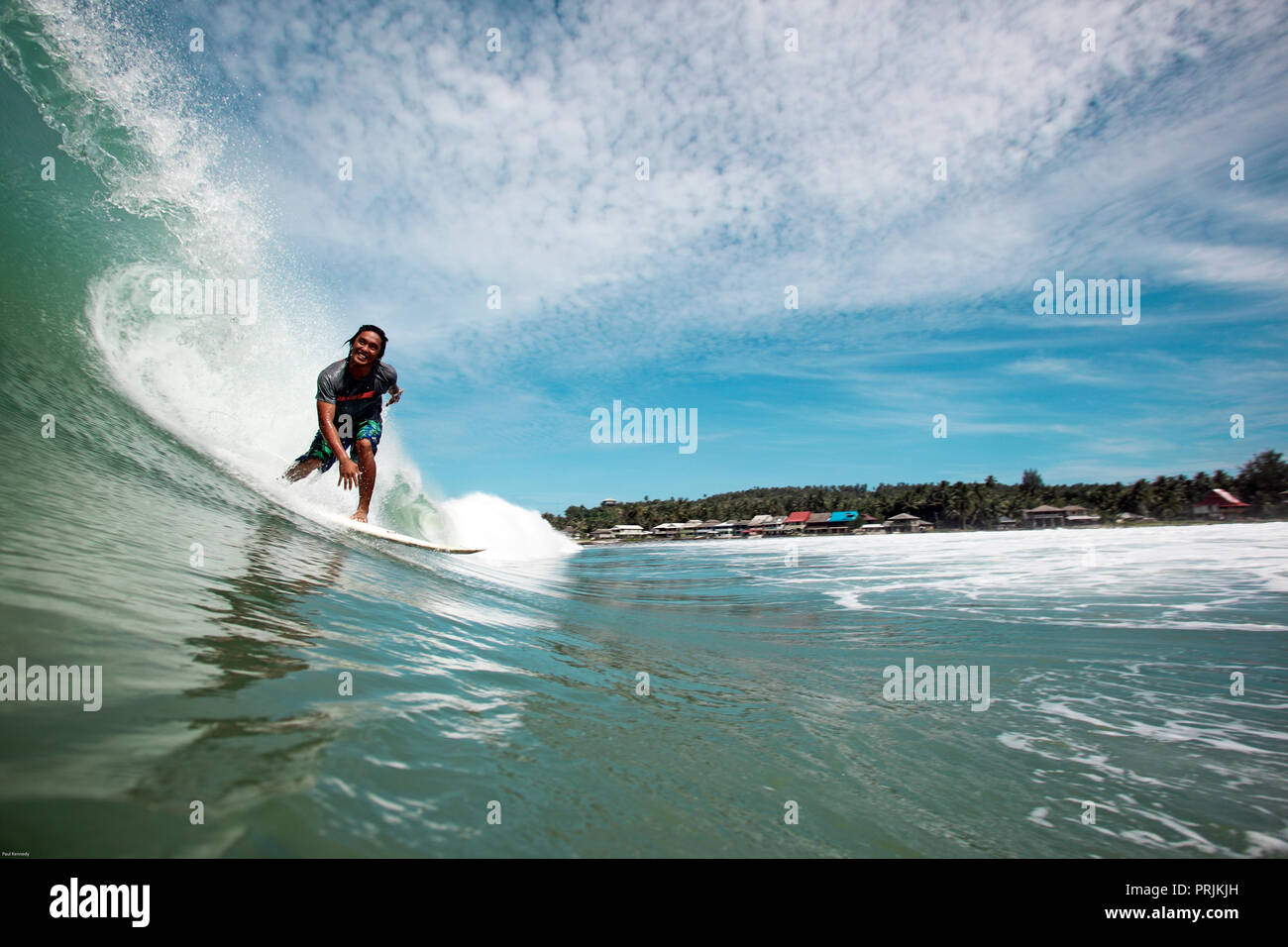 Local surfer riding big wave at Lagundri Bay, Nias, Sumatra Stock Photo ...