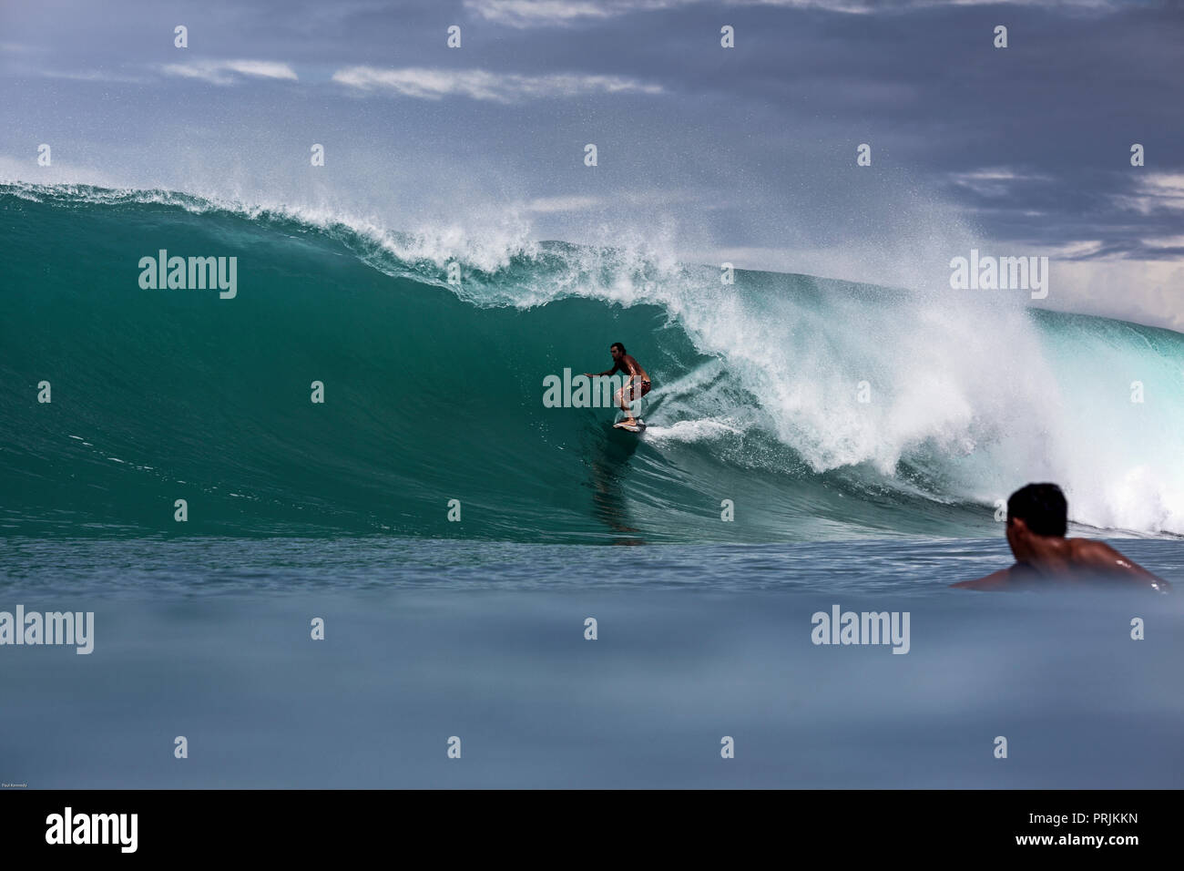 Surfing a big wave at Lagundri Bay on Nias Island, Sumatra, Indonesia ...